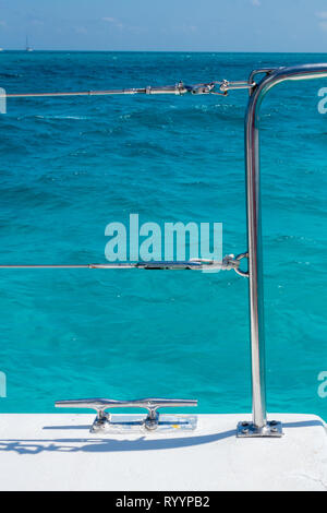 sailboat handrail in the caribbean. metal handrail against crystal ...