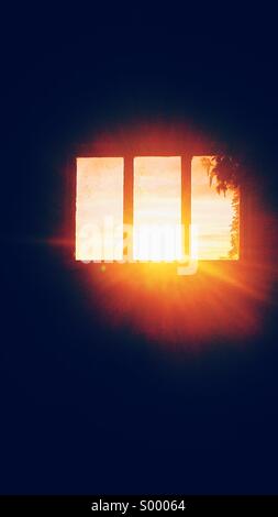 Sunset through window Stock Photo - Alamy