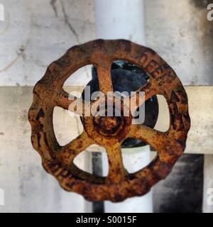 Metal water supply stop cock tap covers in the street UK Stock Photo ...