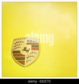 Porsche 911 sports car badge Stock Photo - Alamy