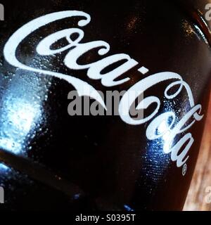 Close-up of a Coca-Cola logo seen displayed amidst festive red lanterns ...
