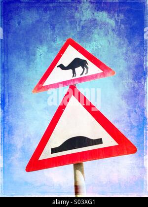 Humps in road traffic warning red triangle road sign on metal pole with ...