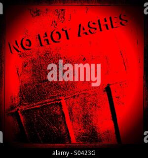 No Hot Ashes warning sign on the lid of a plastic dustbin Stock Photo ...