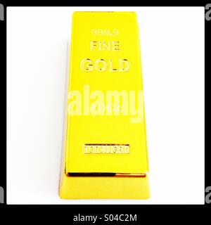 200 gram gold bar or ingot in a mans hand isolated on a white studio ...