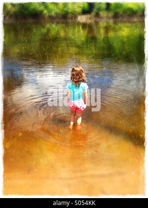 little girl wading in water Stock Photo - Alamy