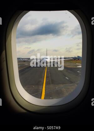 airplane lining up for take off on Manchester ringway airport runway ...