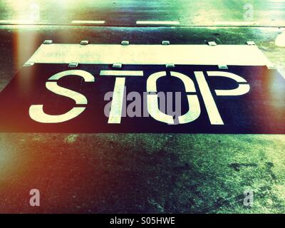 Words stop painted on road Stock Photo - Alamy
