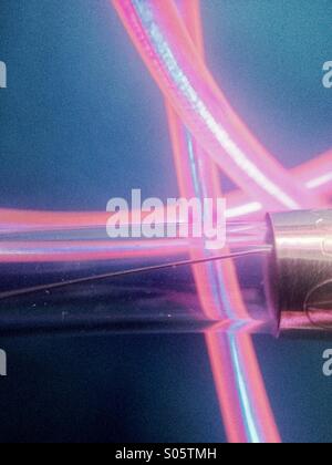 Fuse surrounded by pink glowing wire Stock Photo - Alamy