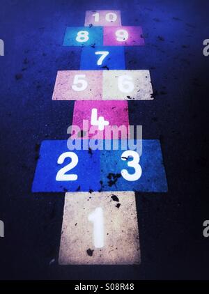 Hopscotch game for children painted on the floor with colorful numbers ...