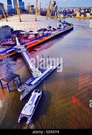 Thames clipper water bus in Tower Hamlets urban landscape & Pool of ...