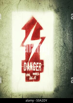 warning sign for high tension danger of electrocution Stock Photo - Alamy