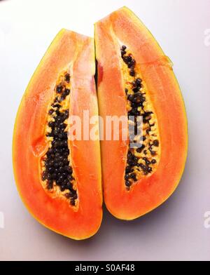 Papaya cut in half Stock Photo - Alamy