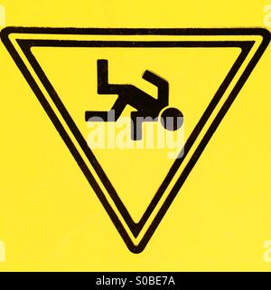 Warning sign with falling man Stock Photo - Alamy