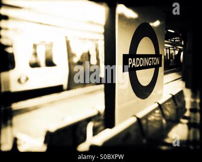 Paddington train station sign & iconic London Underground roundel sign ...