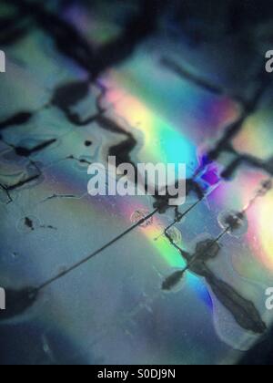 Rainbow effect on an old destroyed CD Stock Photo - Alamy