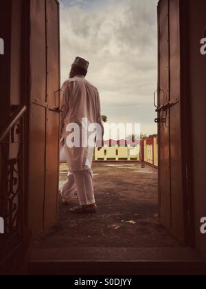 Rear view of an old Pakistani man walking in an alley Stock Photo - Alamy