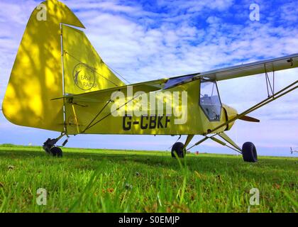 Easy Raider microlight aircraft on the grass under blue sky at North ...
