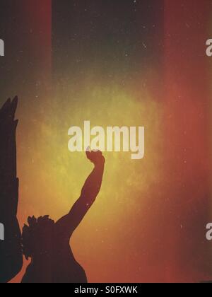 Angel pointing to a dramatic sky Stock Photo - Alamy