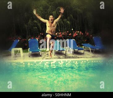 Man Jumping into Swimming Pool Stock Photo - Alamy