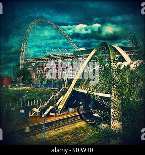The White Horse Bridge across Wembley Stadium railway station showing ...