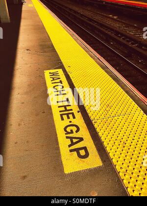 Tactile warning strip, yellow line with black and yellow studs at ...