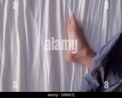 Foot of a sleeping 8 years old child Stock Photo - Alamy