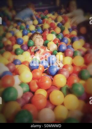 Multicoloured balls in a ball pit Stock Photo - Alamy
