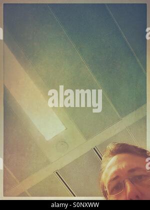 In the office. Looking down while typing Stock Photo - Alamy