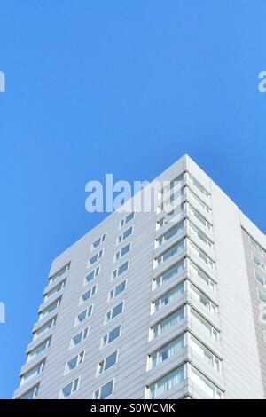 High-rise building and bright blue sky Stock Photo - Alamy