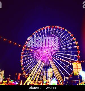 Perish wheel with heart shape in neon lights Stock Photo - Alamy