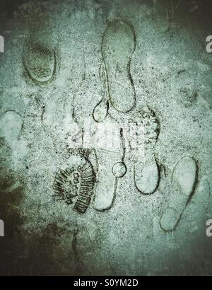 Muddy footprints on a wet muddy forest floor, UK forest floor, Autumn ...