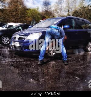 A Car Being cleaned at a Hand Car Wash Unit in a Car Park in Poole ...