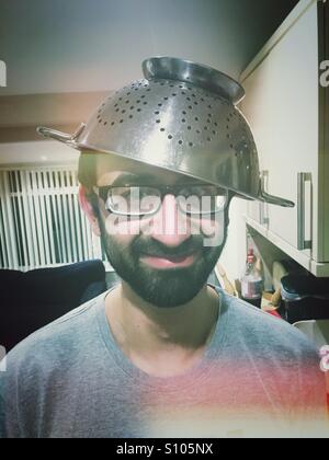 Boy with colander on head Stock Photo - Alamy