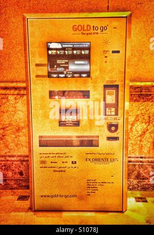 ATM dispensing gold coins and bars, lobby of Emirates Palace hotel, Abu ...