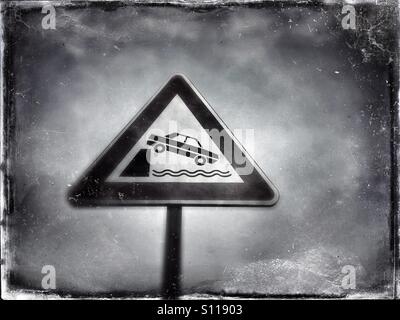 Warning road sign for Quayside or River Bank Stock Photo - Alamy