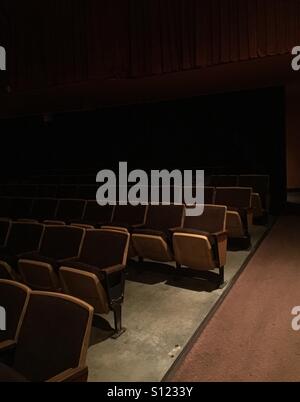 Dark movie theatre interior with screen and chairs Stock Photo - Alamy