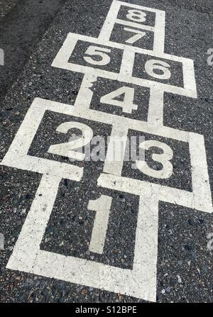 Hopscotch playground game Stock Photo - Alamy
