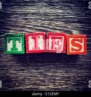 TIES word written with wood block letter toys Stock Photo - Alamy
