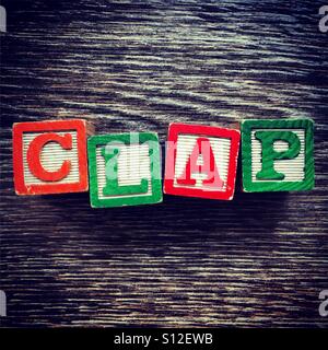 CLAP word written with wood block letter toys Stock Photo - Alamy