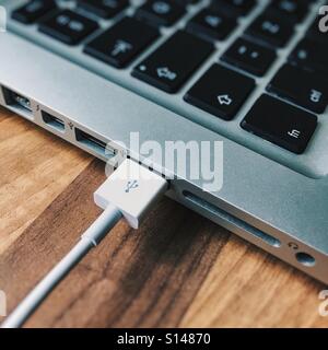 USB cable plugged into laptop Stock Photo - Alamy