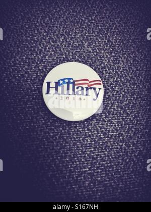 A Hillary Clinton 2016 pin badge over the US flag symbolizing her ...