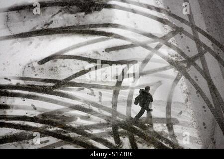 A person walks across an ice covered street in Montreal, Monday, Dec ...