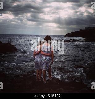 Two girls at the sea Stock Photo - Alamy