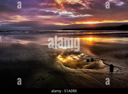 A winter sunset on Tramore beach Stock Photo - Alamy
