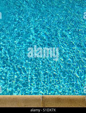 Post at the edge of a swimming pool Stock Photo - Alamy