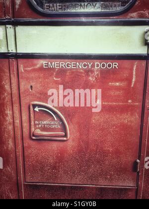Classic bus red emergency door Stock Photo - Alamy