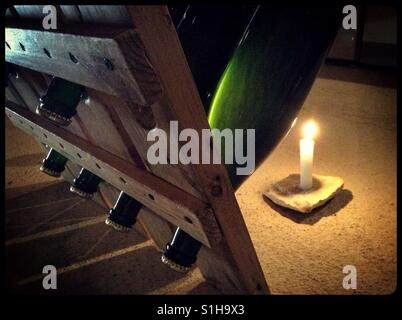 The process of riddling homemade sparkling wine using a traditional ...