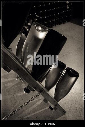 The process of riddling homemade sparkling wine using a traditional ...