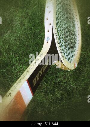 Old vintage wooden tennis racket on isolated stone background with ...