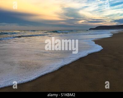 Sunrise or sunset at beach in Porto Rotondo reflex Stock Photo - Alamy